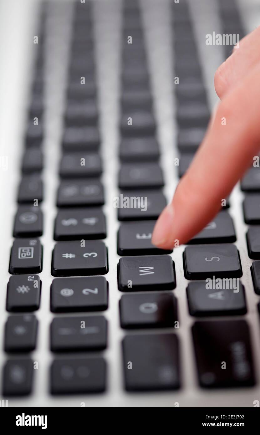 Finger tapping the keyboard high quality photo Stock Photo - Alamy