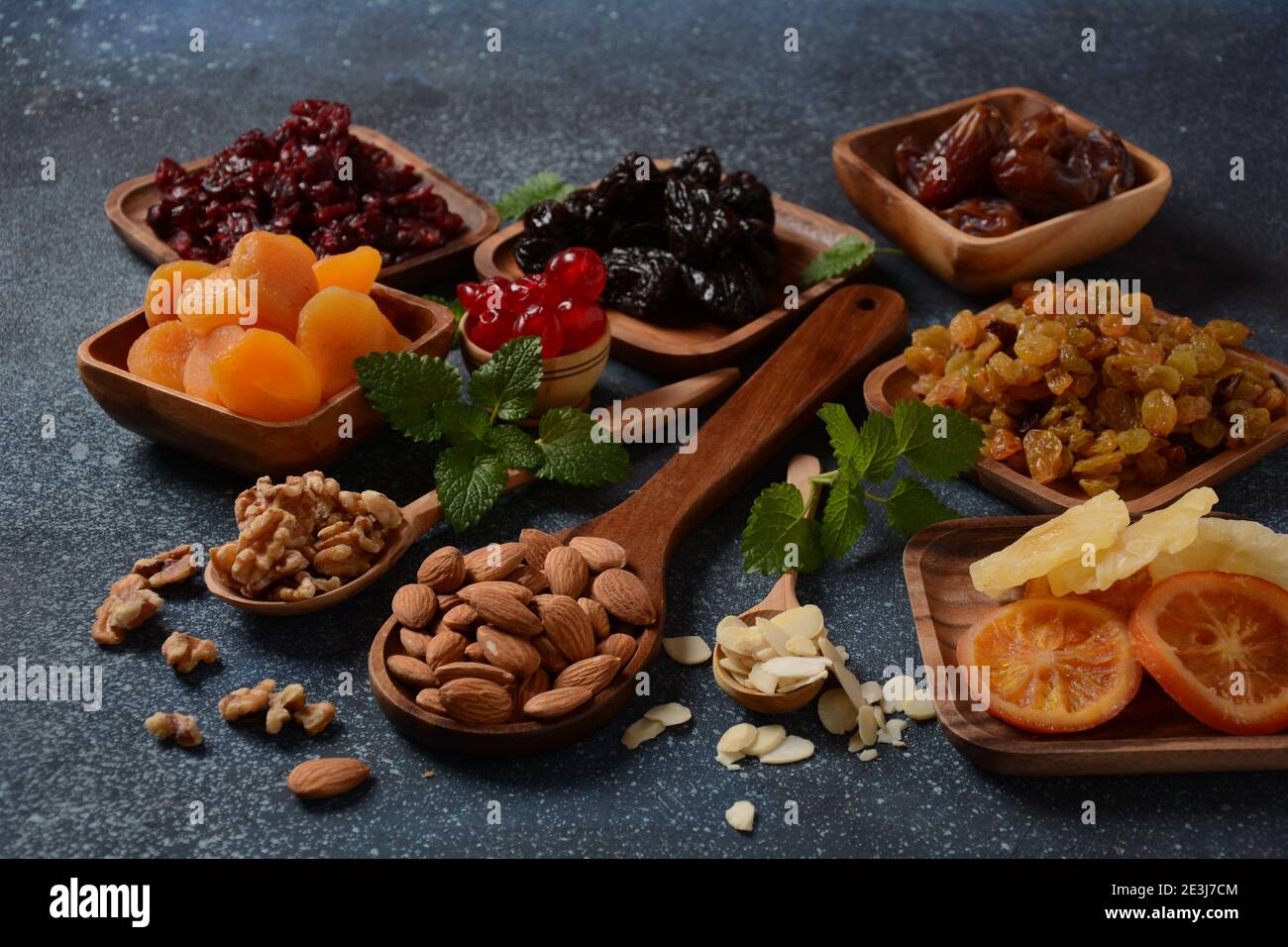 Mix of dried and sun-dried fruits, in a wooden trays . View from above ...