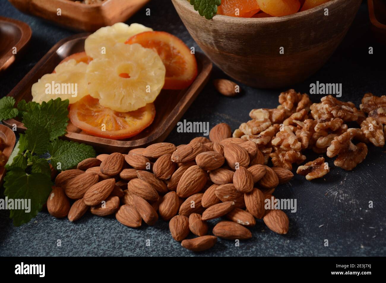 Mix of dried and sun-dried fruits, in a wooden trays . View from above ...