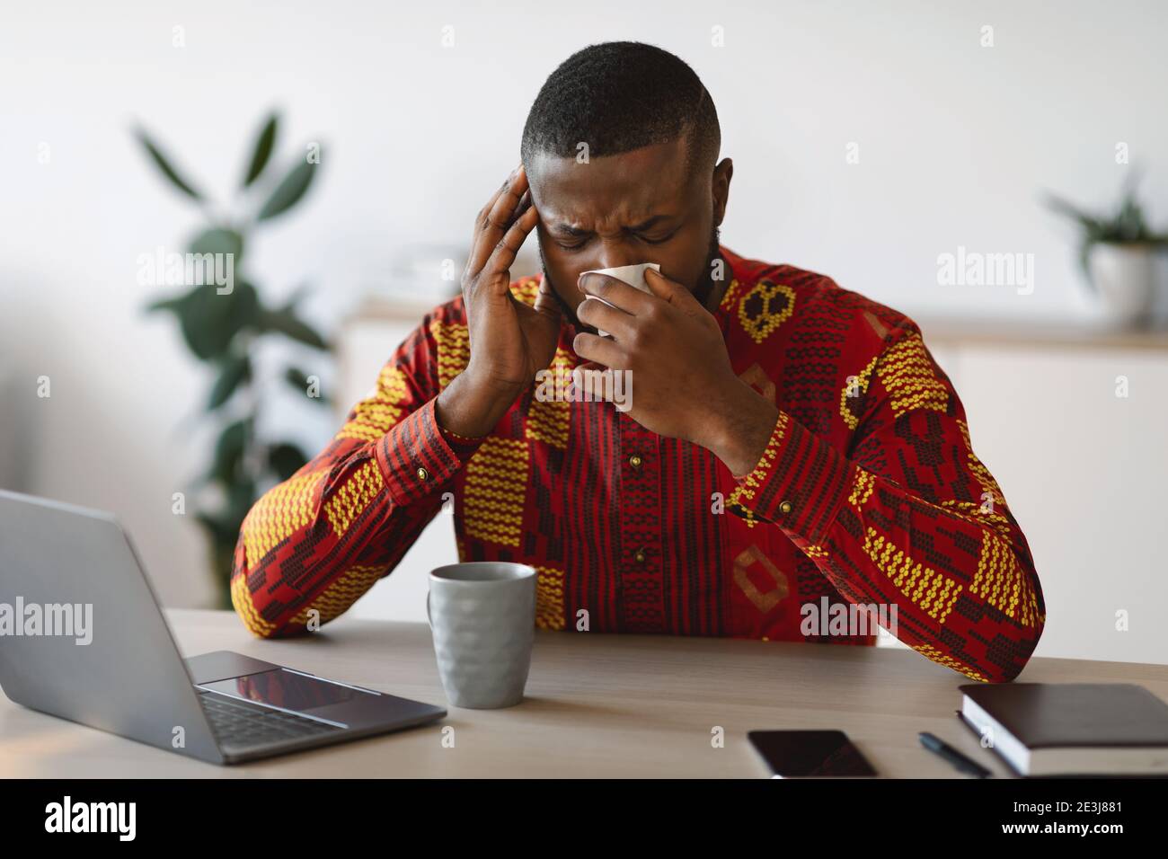 Sick African Man In Traditional Shirt Feeling Unwell While Working In ...