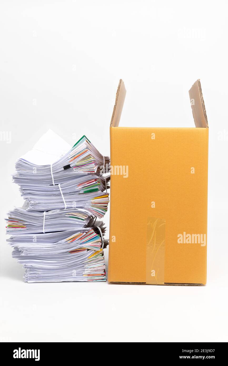 Stack of Documents and corrugated cardboard box isolated on white ...