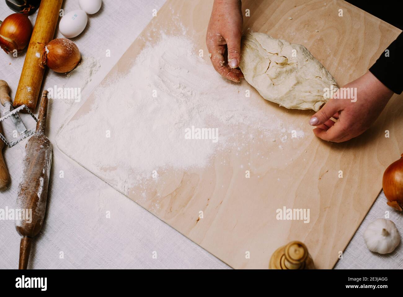 Making dough by female hands at bakery. Culinary, cooking, bakery ...