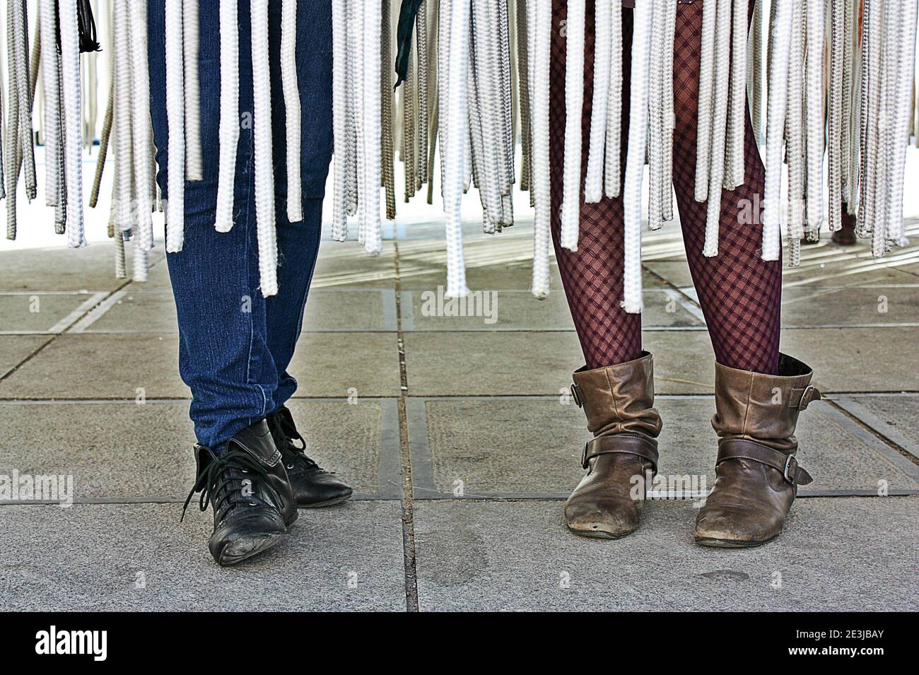 legs with shoes between white laces Stock Photo - Alamy