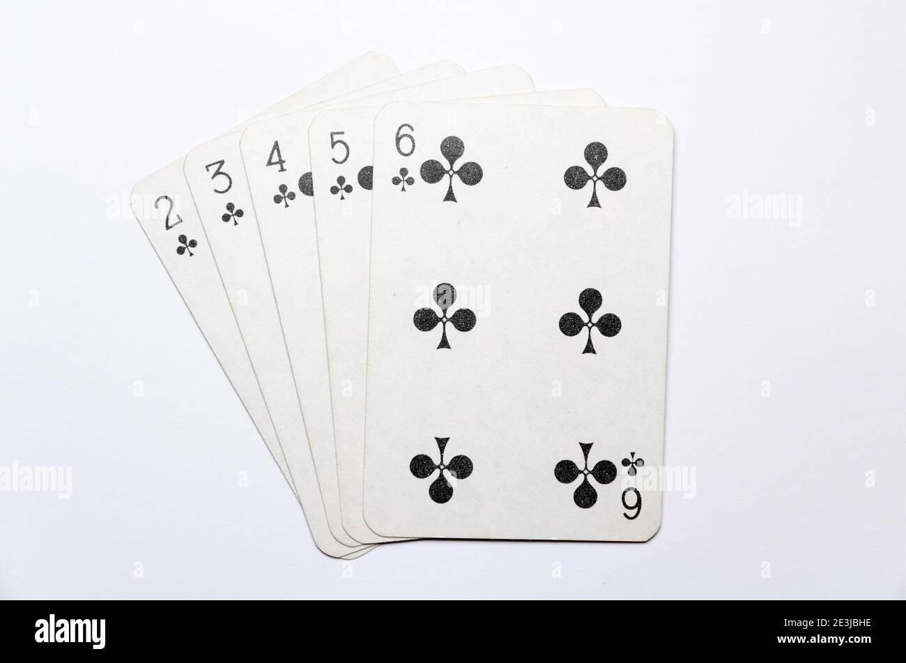 Playing cards on white background, poker game hand, straight flush ...