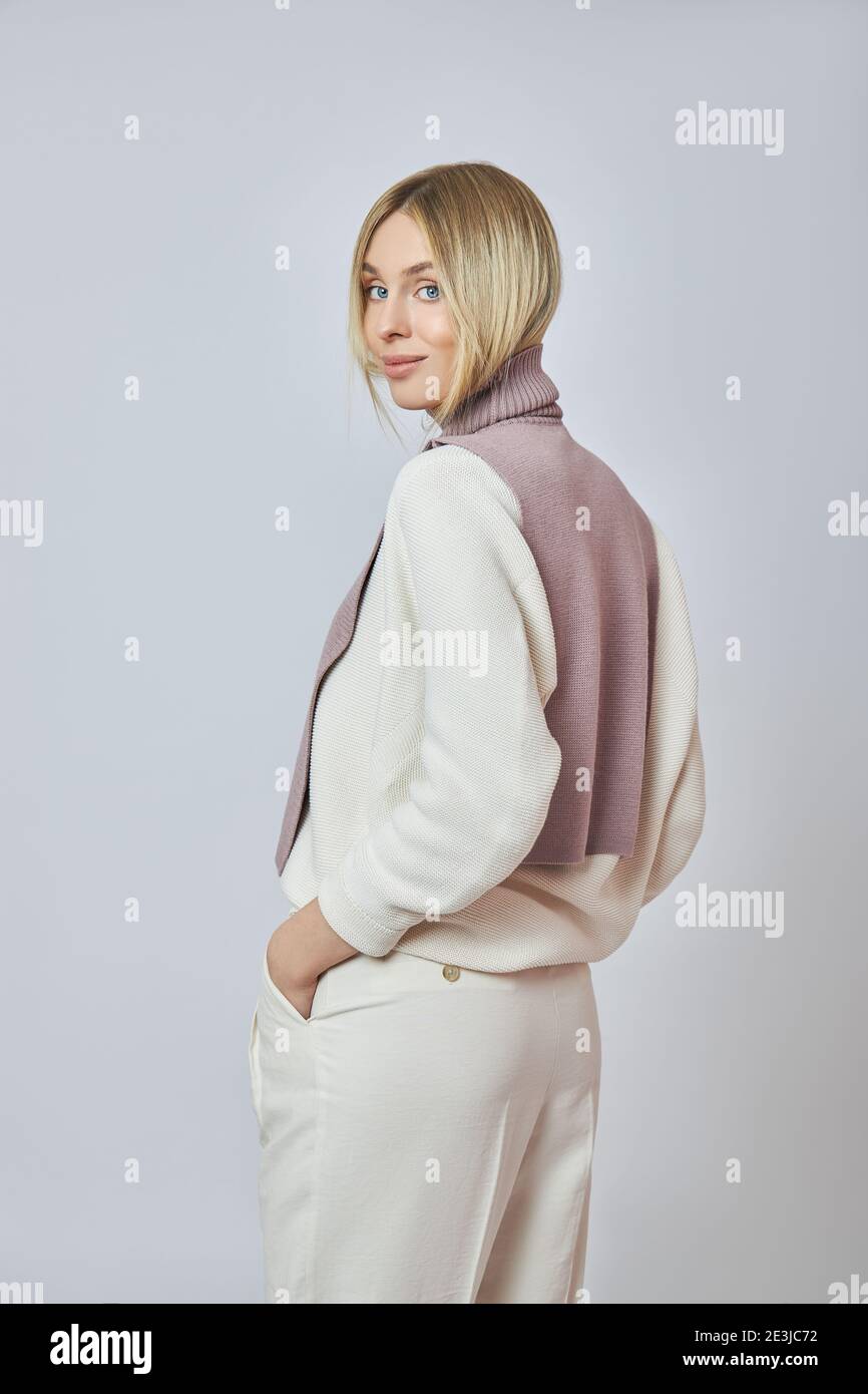 Blonde woman with a shirt front around her neck. Clothing for autumn ...