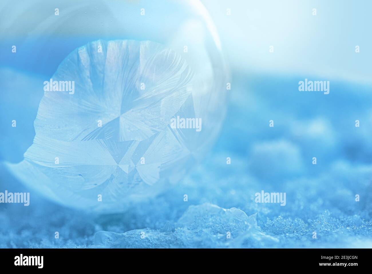 frozen bubble with bokeh background. Beautiful frosty patterns on ...