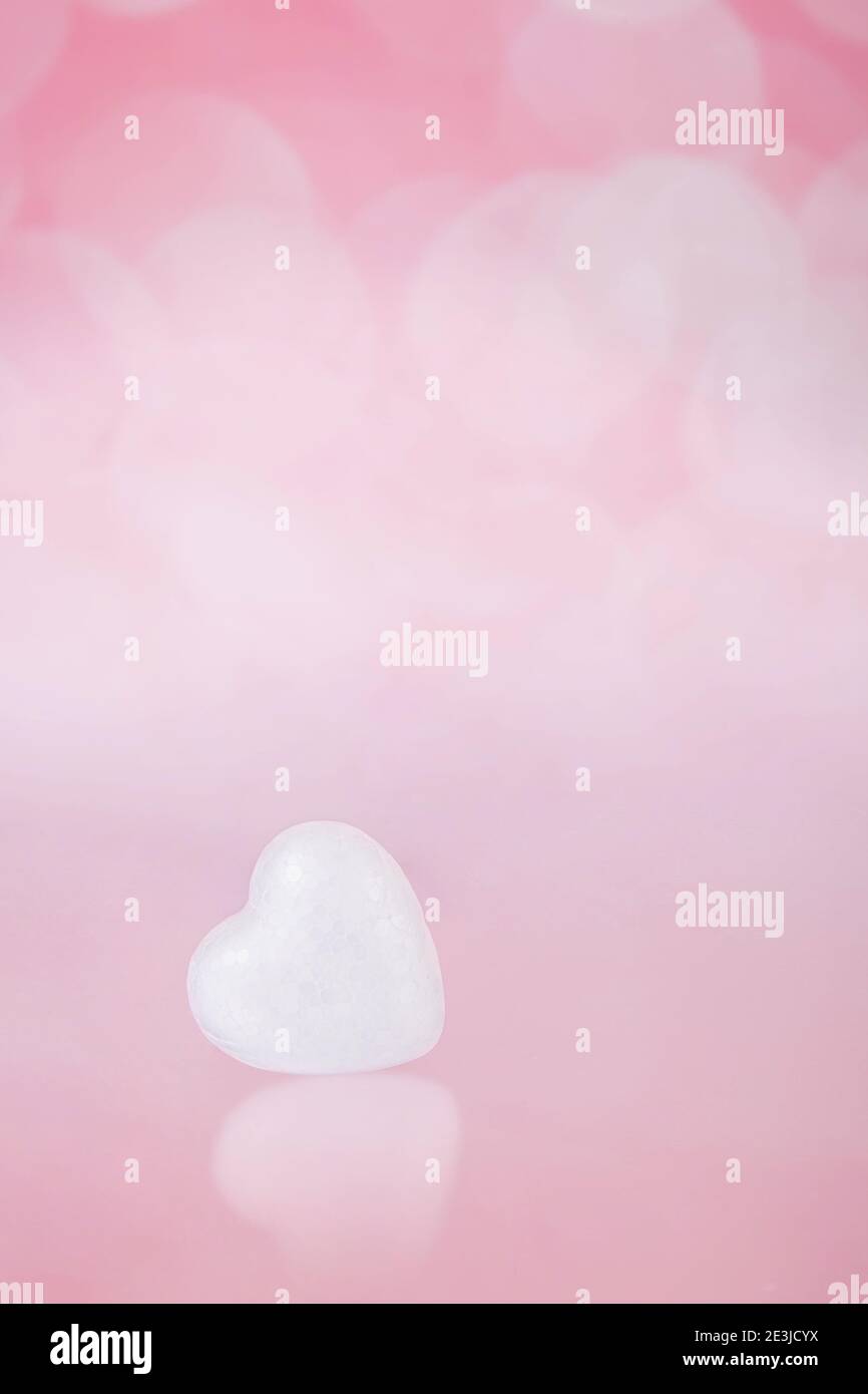 One white heart on a pink with bohe background Stock Photo - Alamy