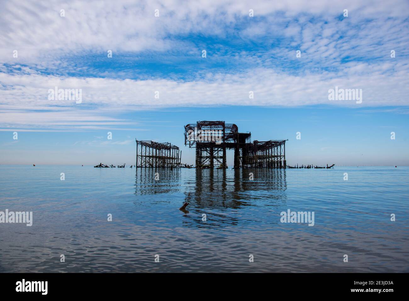 Brighton's Iconic West Pier reflecting on Low Tide on a calm morning ...