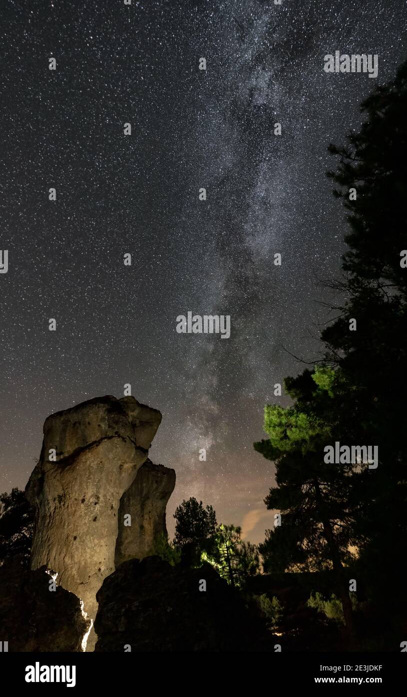 Illuminated boulder under milky way with text space Stock Photo - Alamy