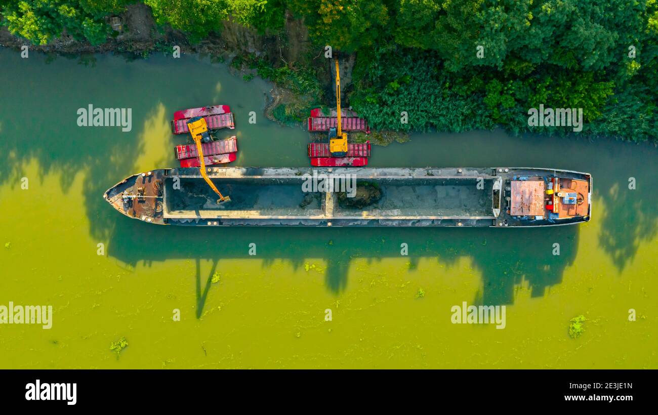 Above top view on two excavators dredge as they dredging, working on ...