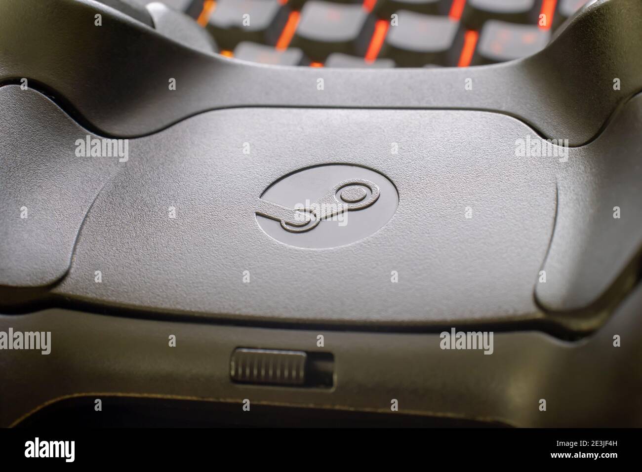 Steam controller on a red illuminated gaming keyboard Stock Photo - Alamy