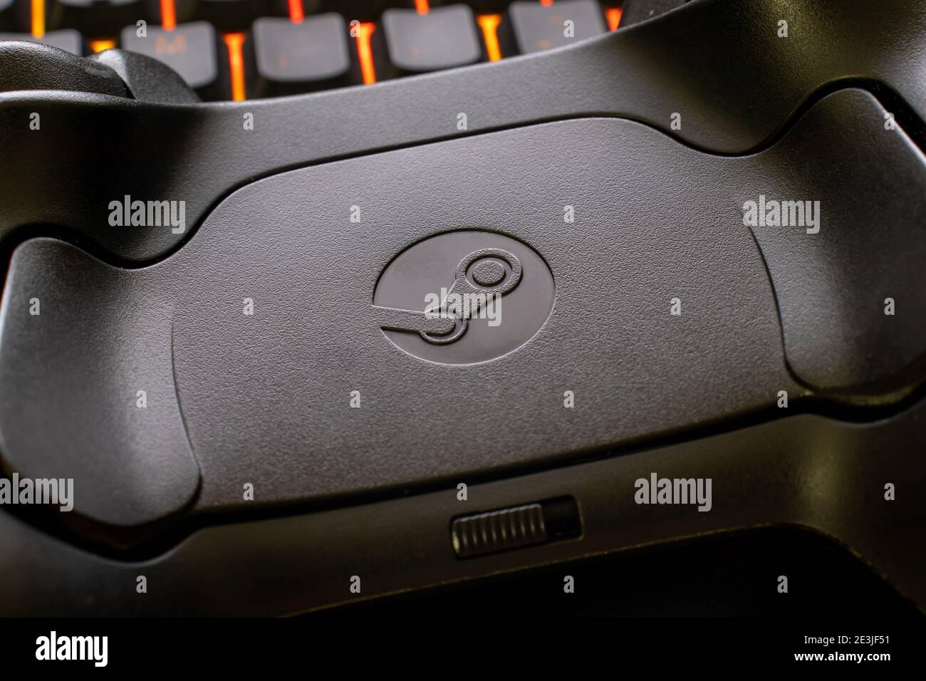 Steam controller on a red illuminated gaming keyboard Stock Photo - Alamy