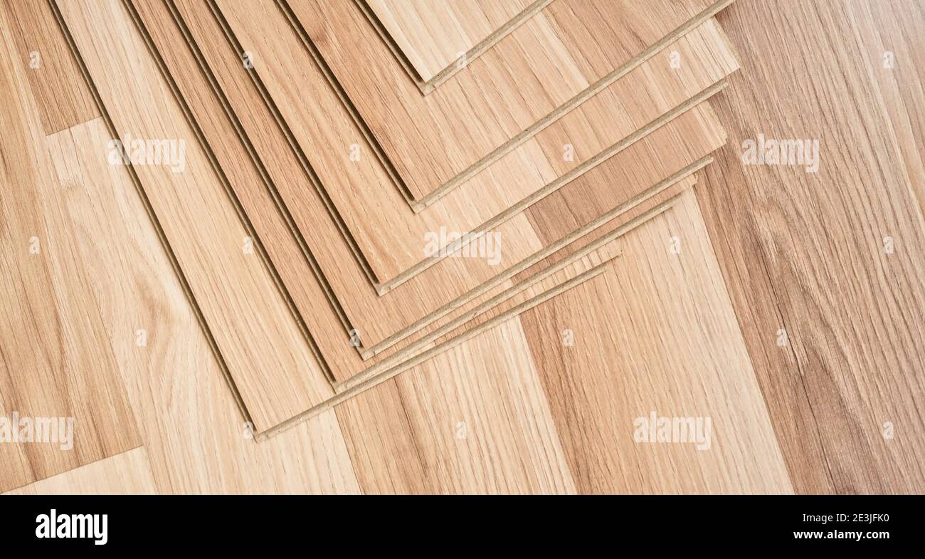 Laminated floor tiles arranged on ground, ready for installation, view ...