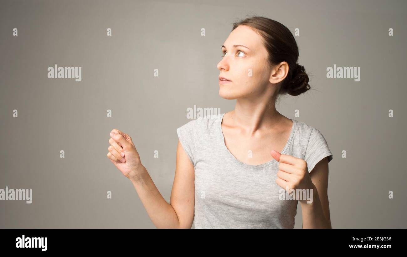 young woman shows something Stock Photo - Alamy