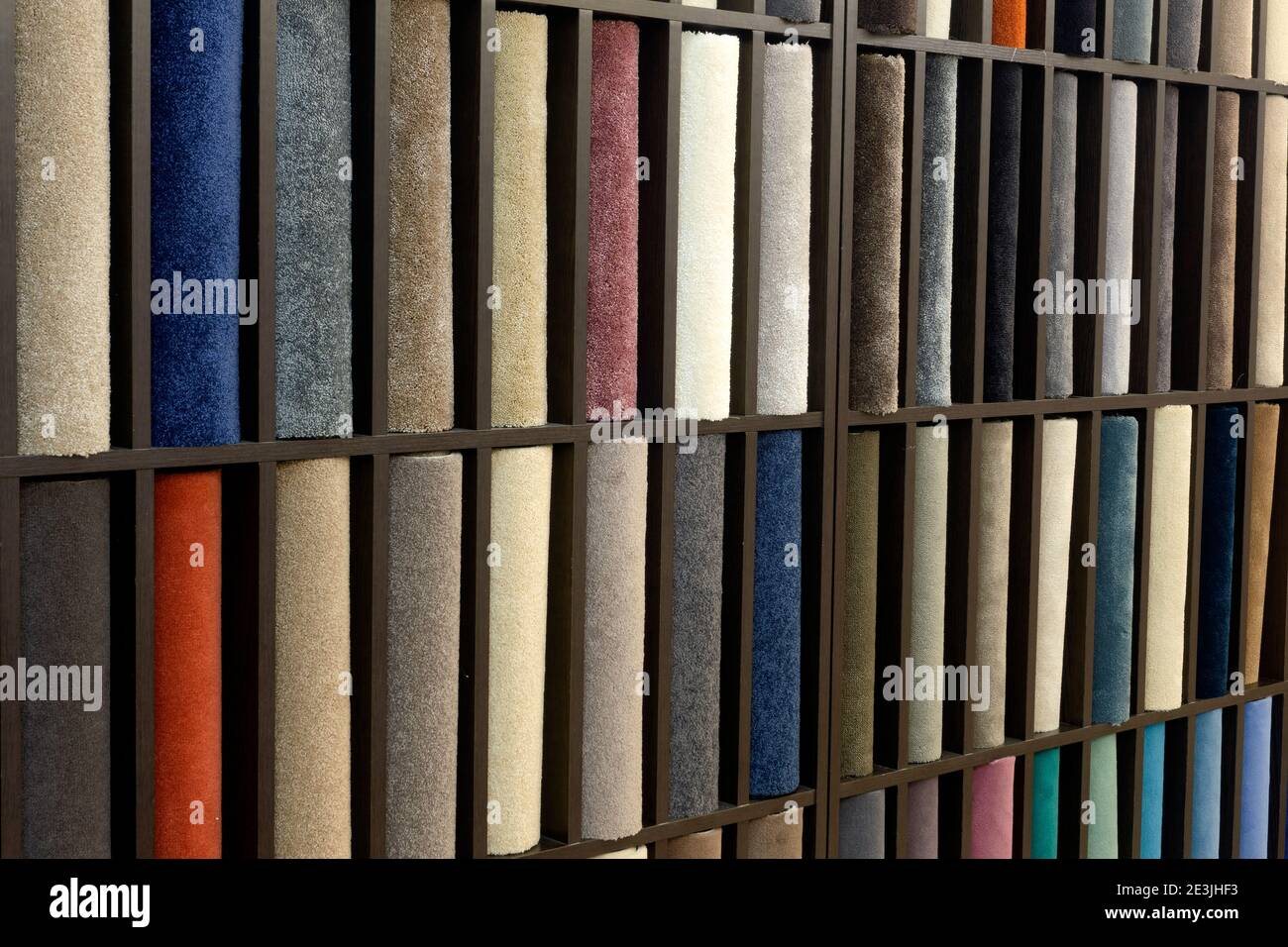 Samples of colored carpets at the stand. Various carpet designs for the ...