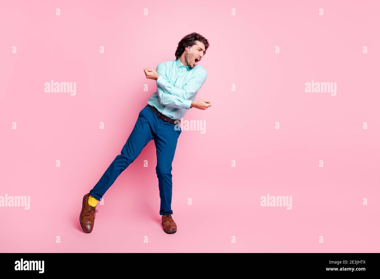 Full length photo portrait of guy dancing screaming isolated on pastel ...