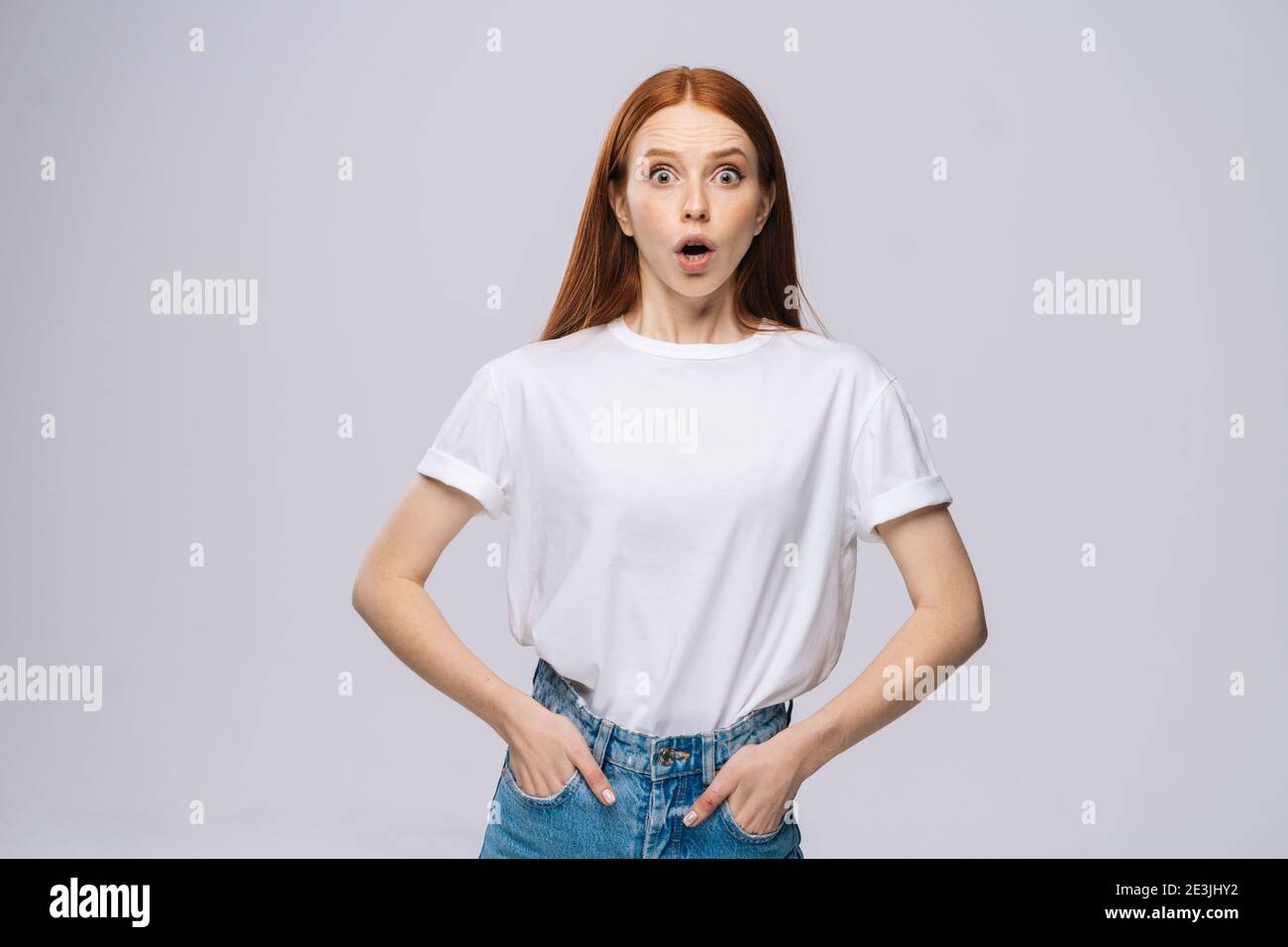 Terrified horrified puzzled young woman with bugged eyes and jaw ...