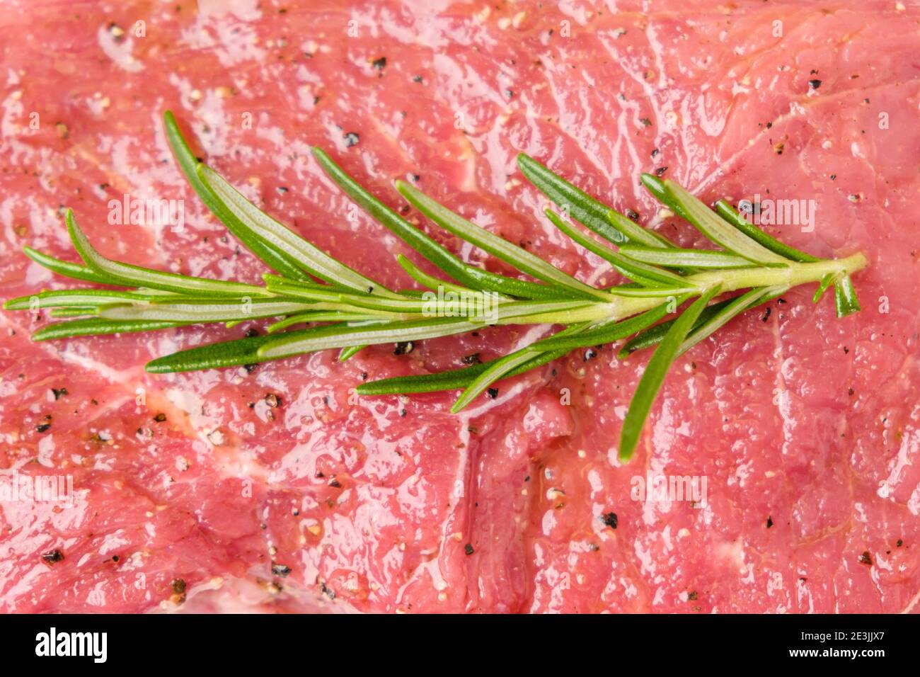 Raw beef steak meat with branch of rosemary and species isolated on a ...