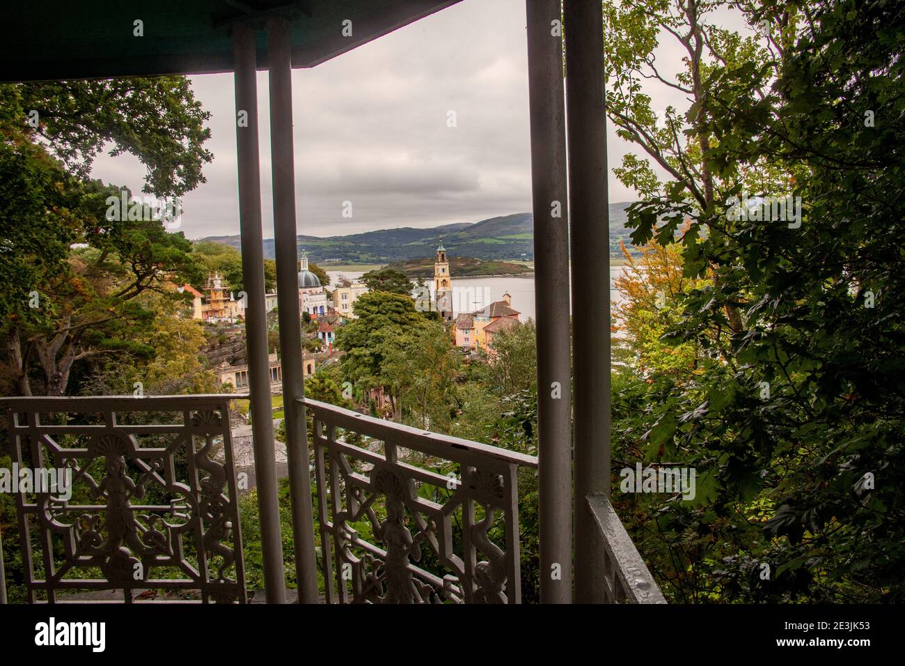 View through trees of Portmeirion, a village in Wales, designed by Sir ...