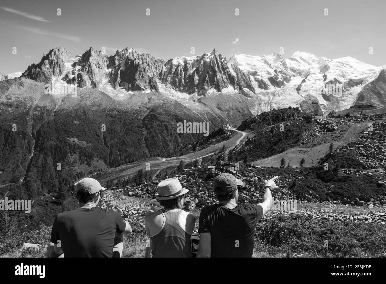 French Alps summer travel. Three friends admiring beautiful snow ...