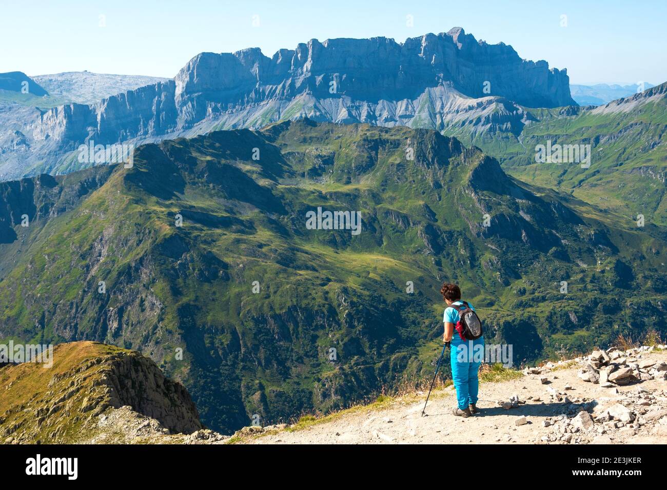 Active holidays for seniors. Senior woman with Nordic walking stick ...