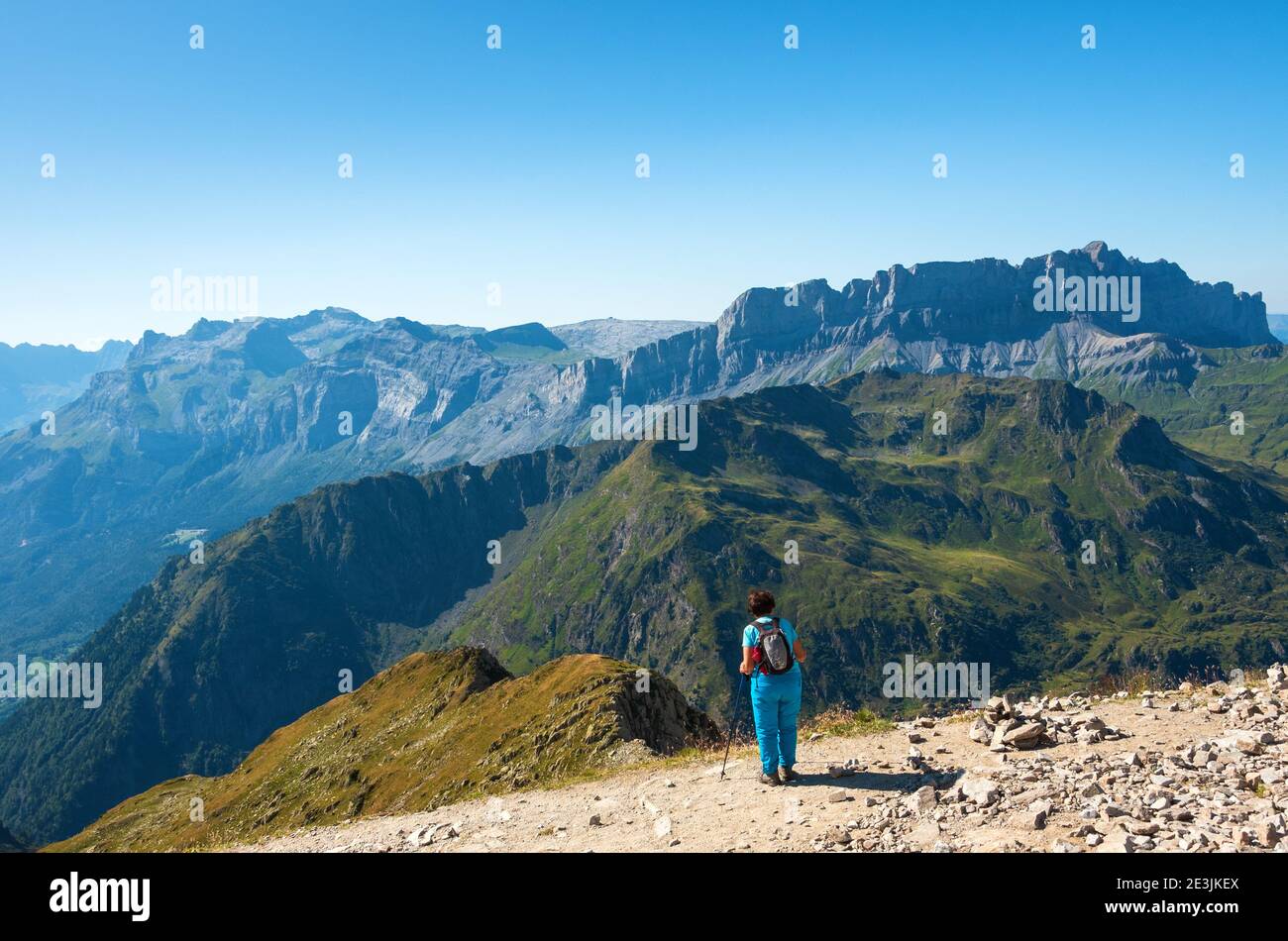 Active holidays for seniors. Senior woman with Nordic walking stick ...