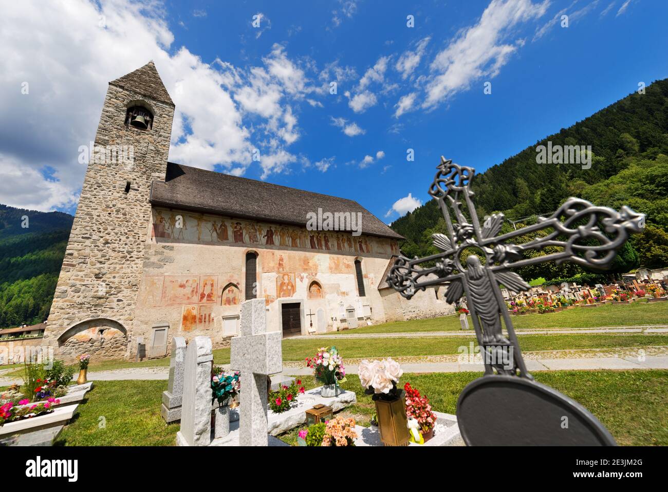 Ancient church of San Vigilio (1515) in Pinzolo, Trento Italy with the famous fresco La danza ...
