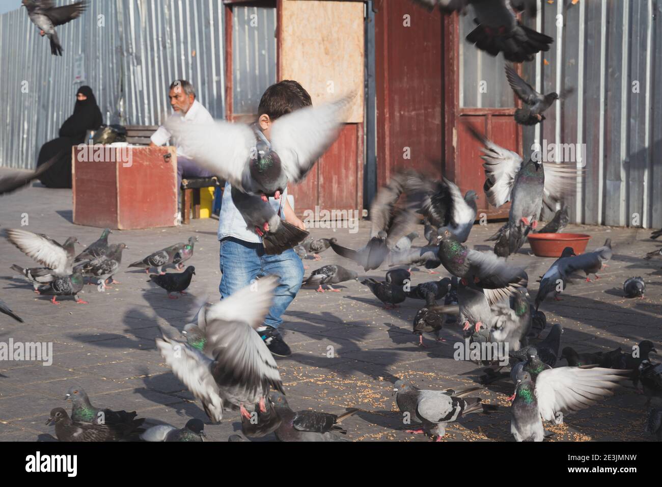 Istanbul, Turkey - September 18: A young Turkish boy runs amongst a ...