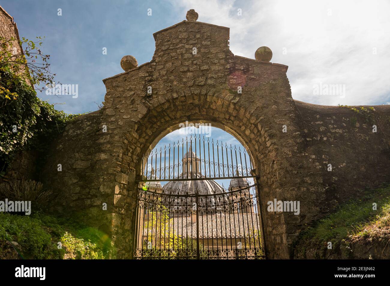 View of the dome of the Basilica of Santa Margherita through a gate of ...