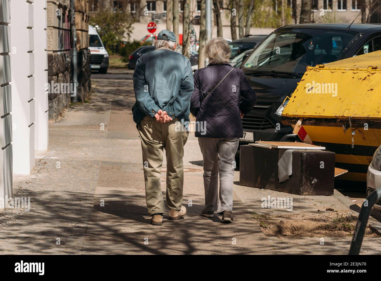 Old Couple from behind, An old couple is walking in the spring ...