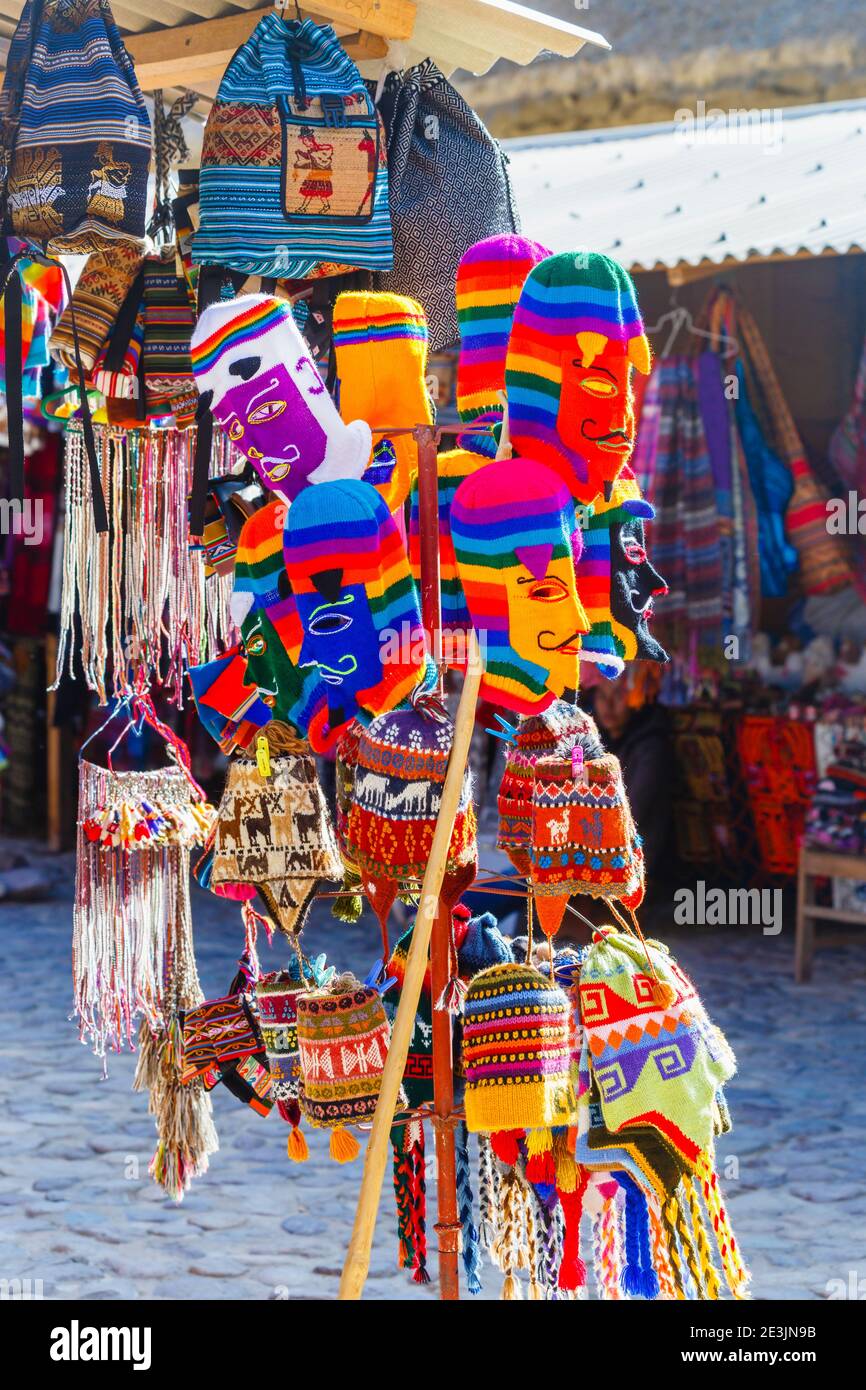 Colourful knitted masks and hats on display for sale in a souvenir ...