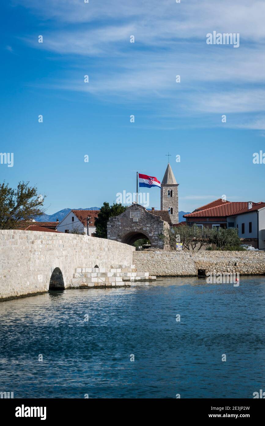 Croatian flag on the lower city gate to the Old Town of Nin, a town in ...