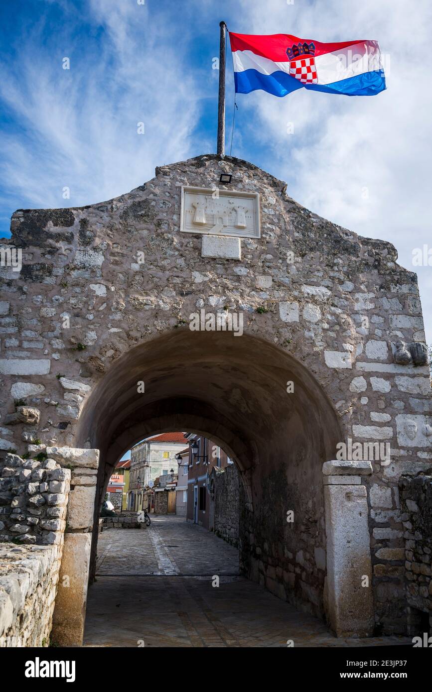 Croatian flag on the lower city gate to the Old Town of Nin, a town in ...