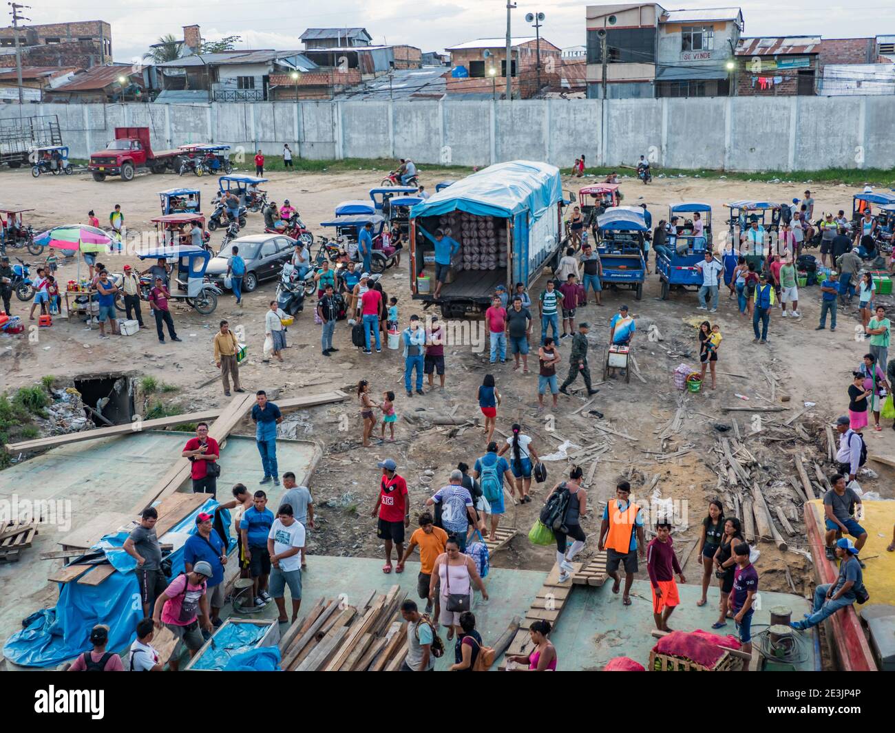 Iquitos, Peru - Dec, 2019: A crowd of local people on a board cargo ...