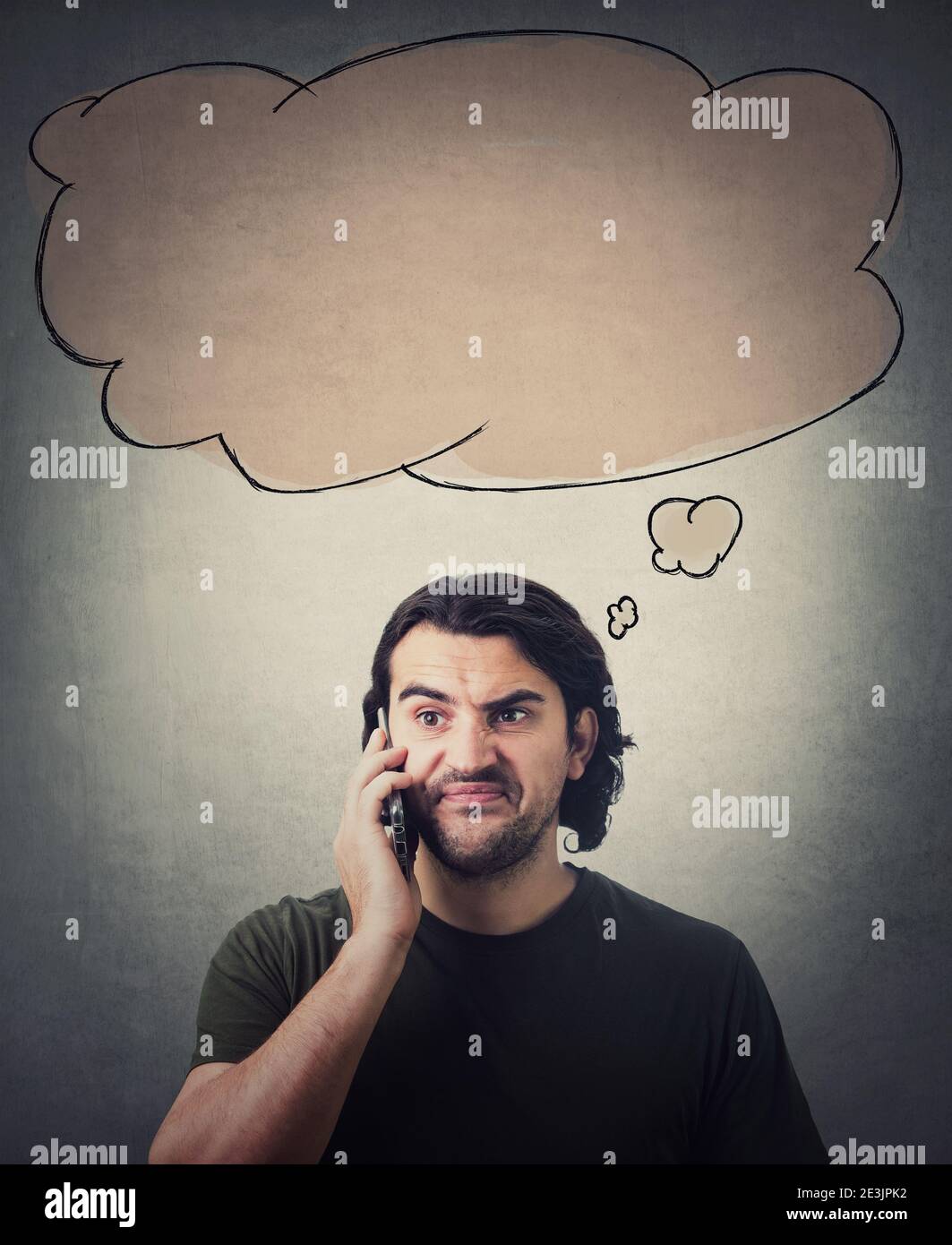 Frustrated man during a phone conversation, makes a dissatisfied ...