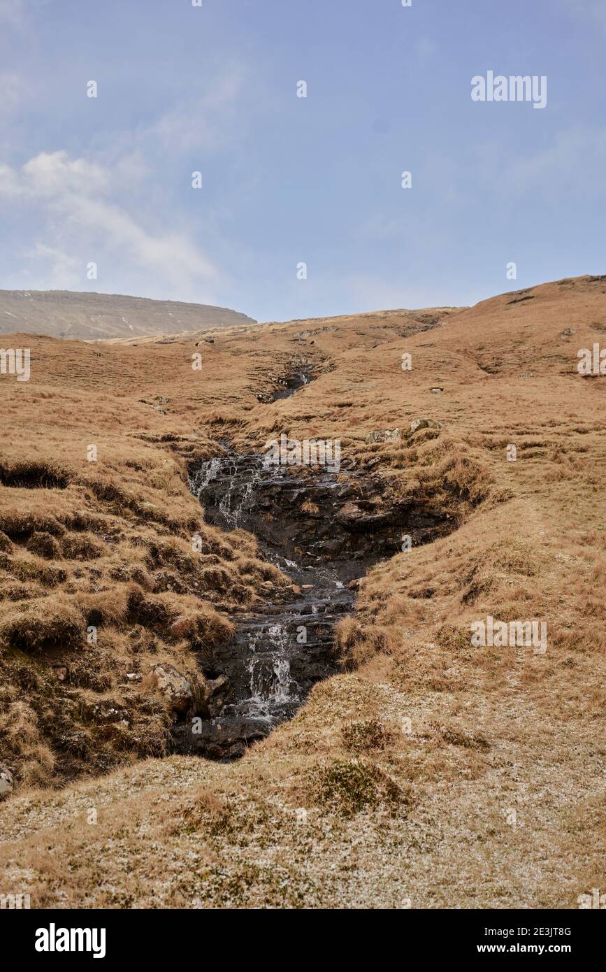 Stream along hillside in Faroe Islands Stock Photo - Alamy