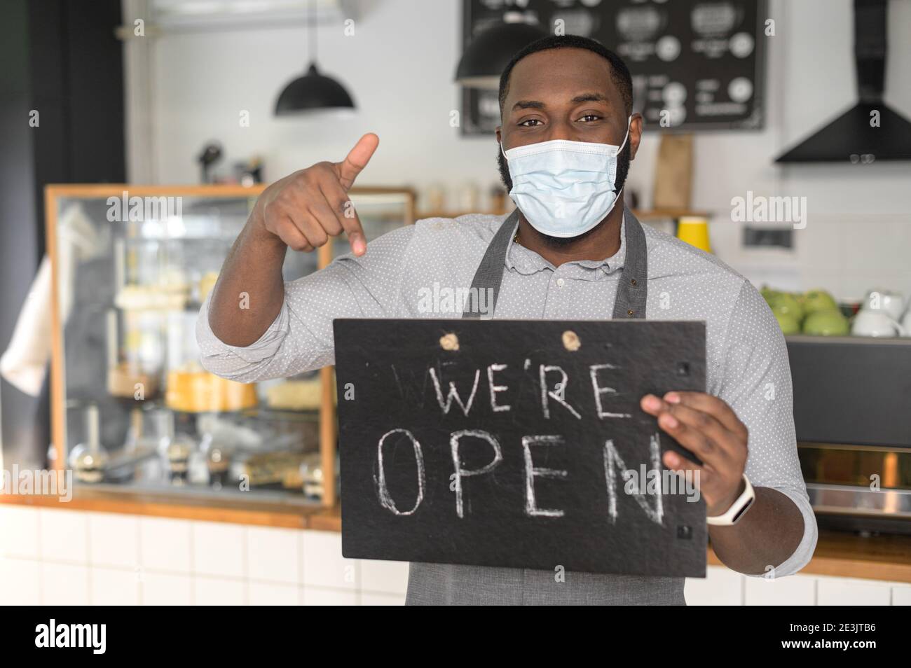 African american waiter in mask hi-res stock photography and images - Alamy