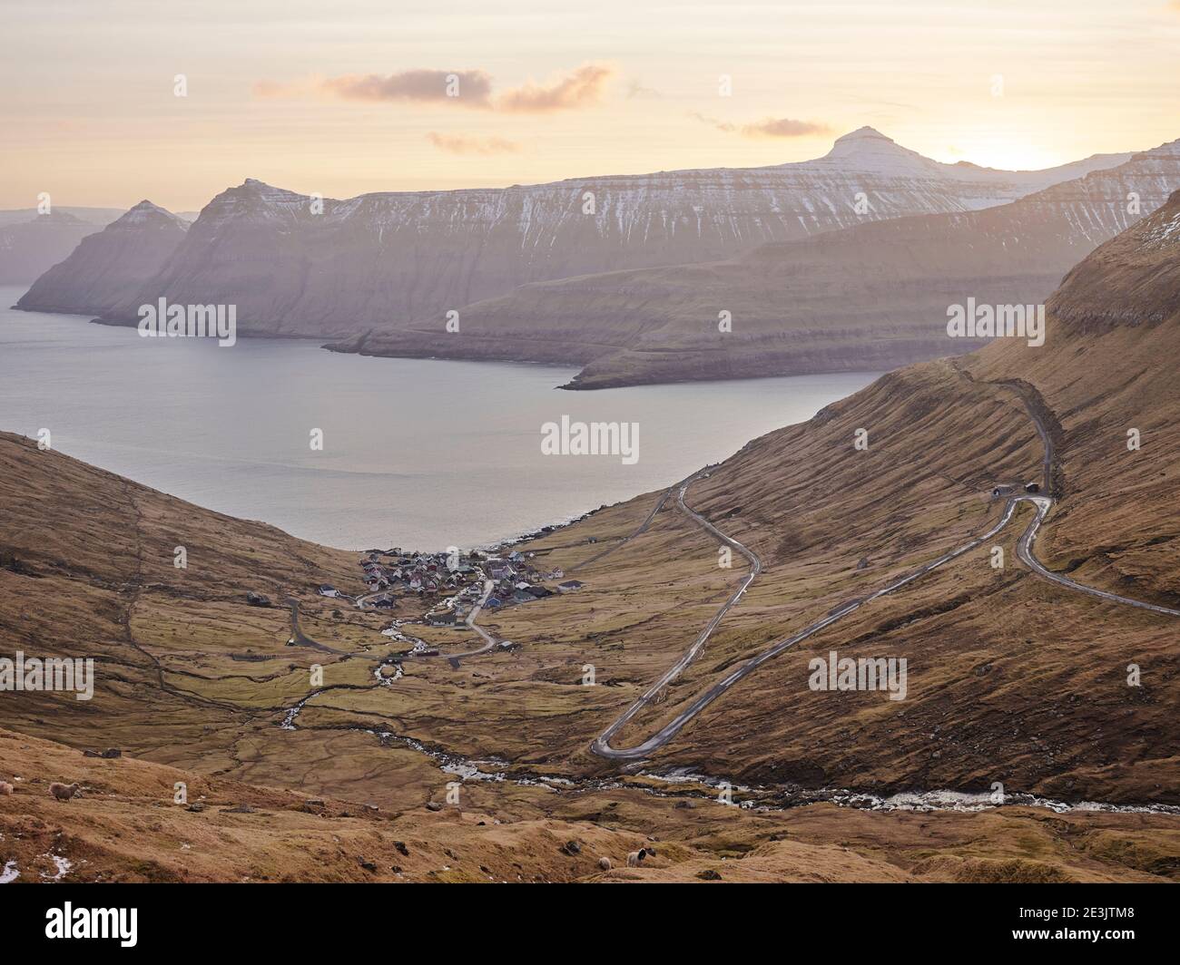 Funningur town from mountain above at sunrise in the Faroe Islands ...