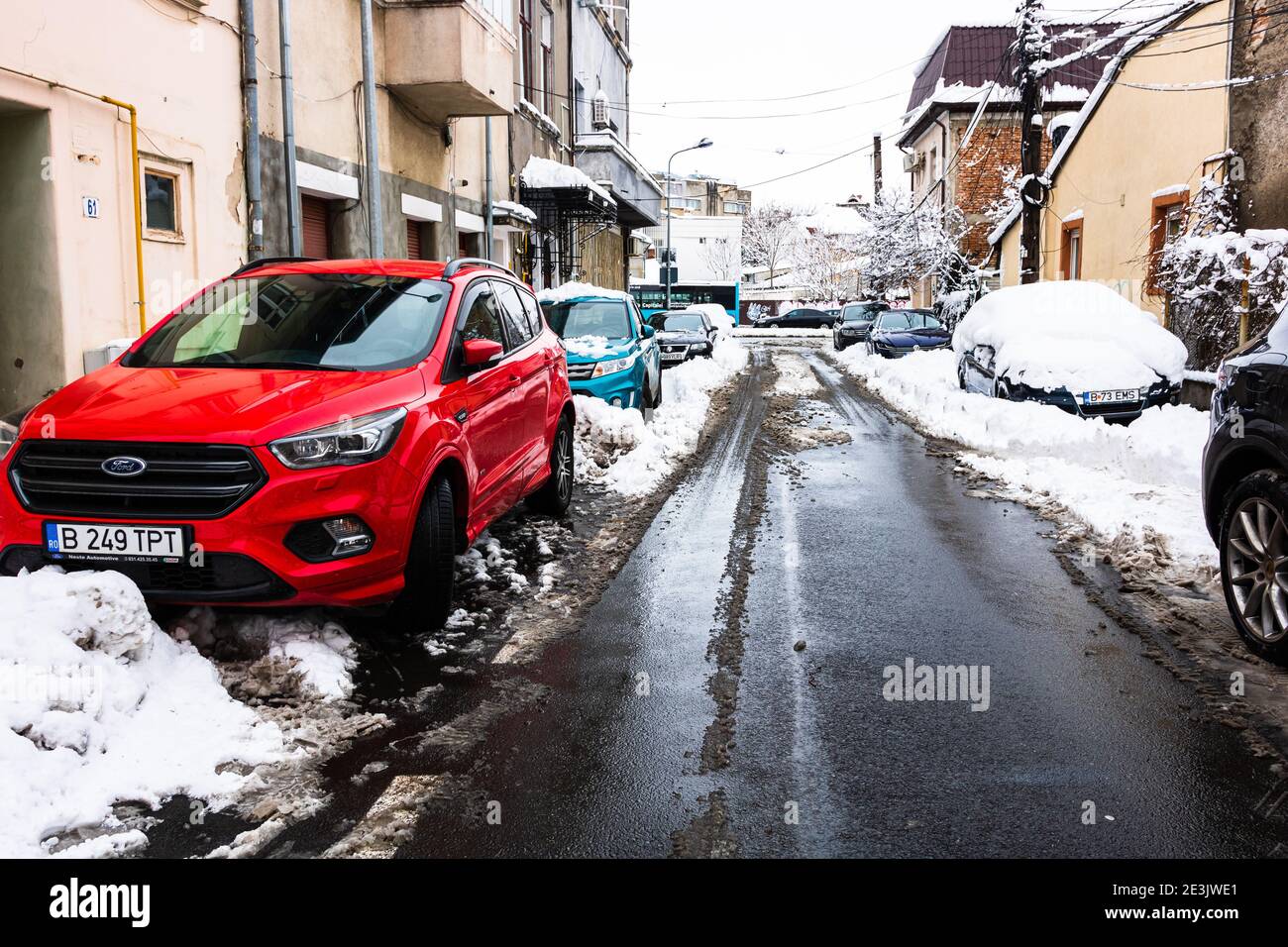 Snow on cars in the morning. Winter season, icy cars. Winter concept ...