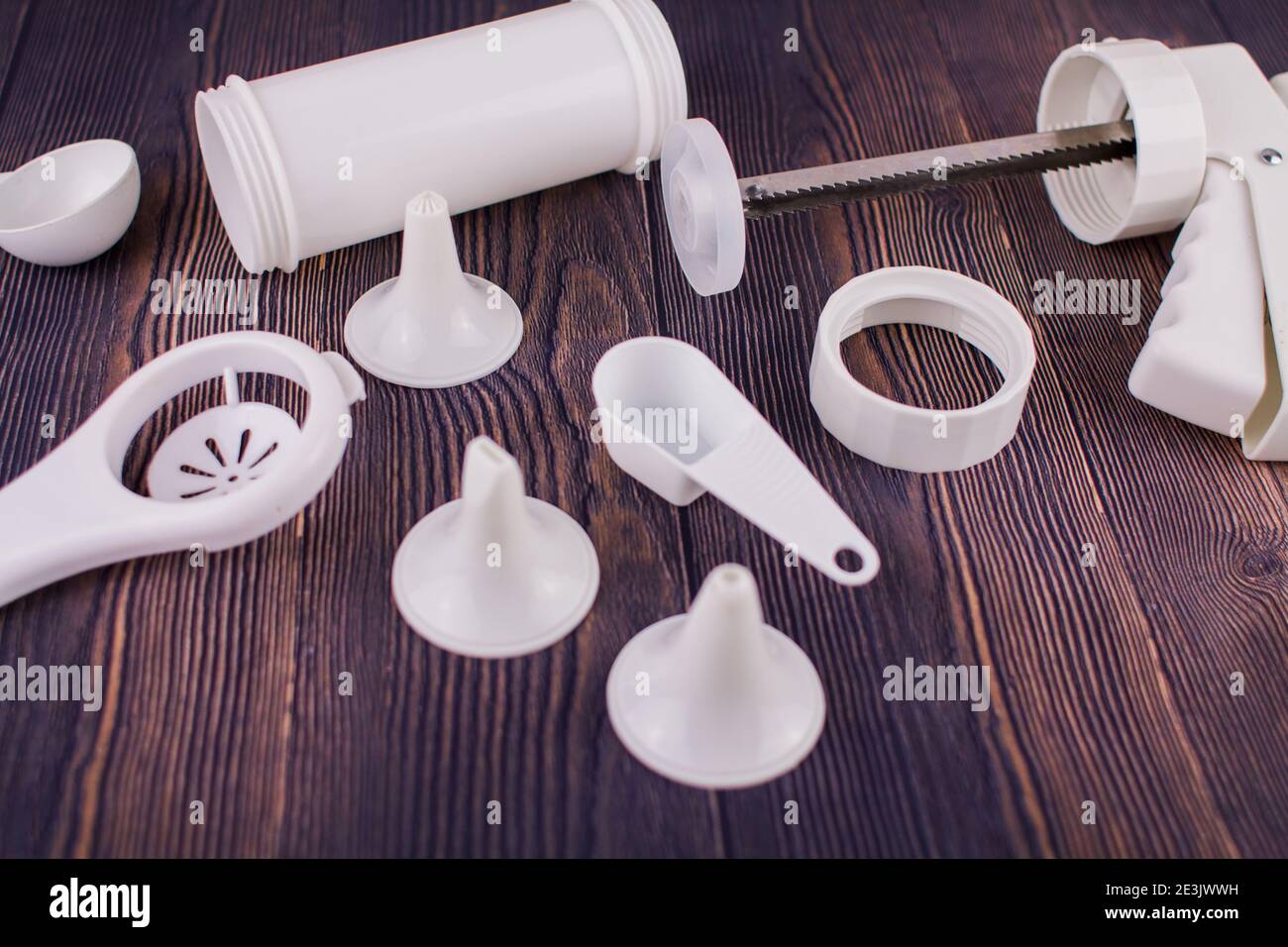 a pastry syringe with molds for cream and cookies Stock Photo - Alamy