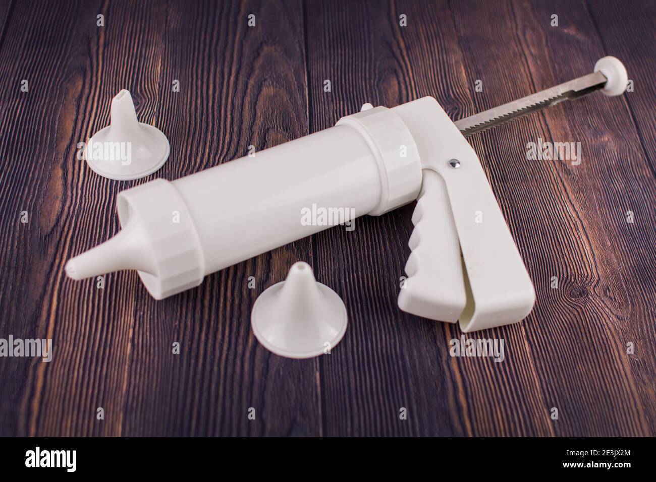 a pastry syringe with molds for cream and cookies Stock Photo - Alamy