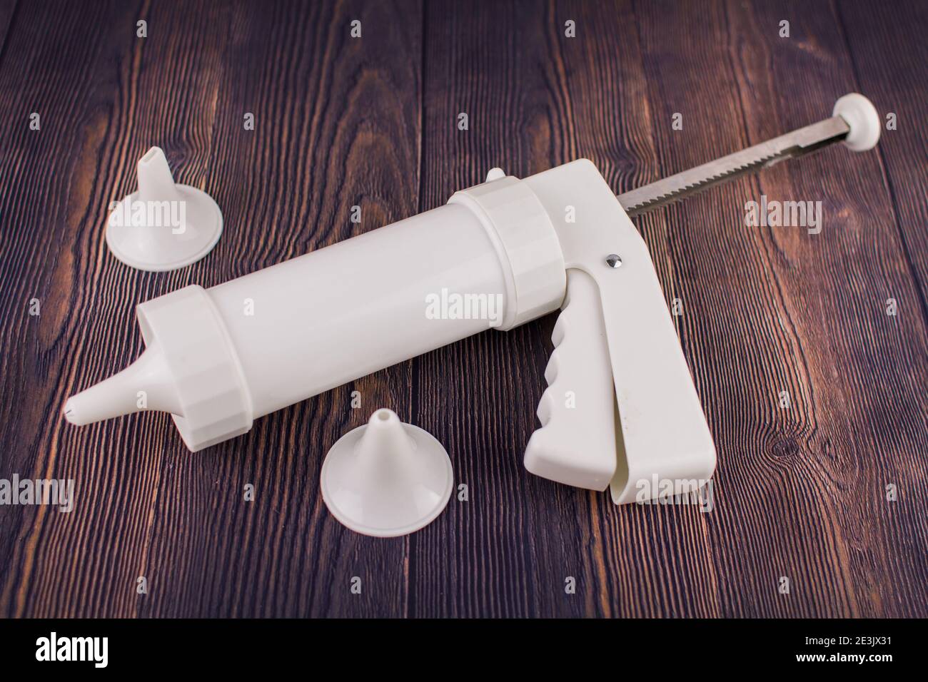 a pastry syringe with molds for cream and cookies Stock Photo - Alamy