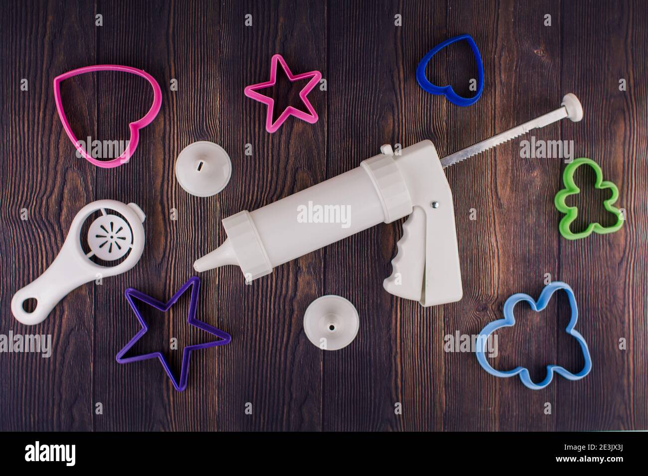 a pastry syringe with molds for cream and cookies Stock Photo - Alamy