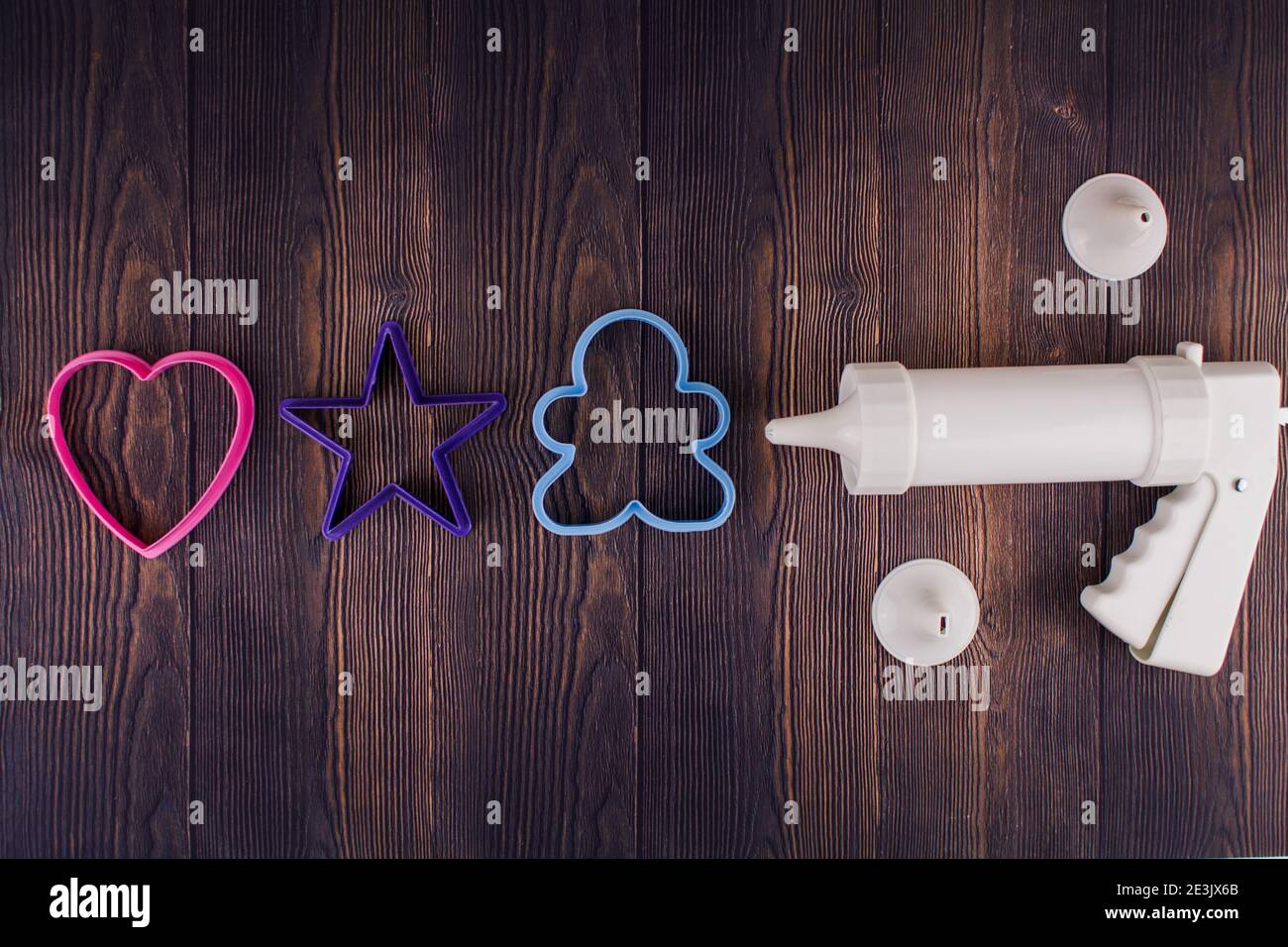 a pastry syringe with molds for cream and cookies Stock Photo - Alamy