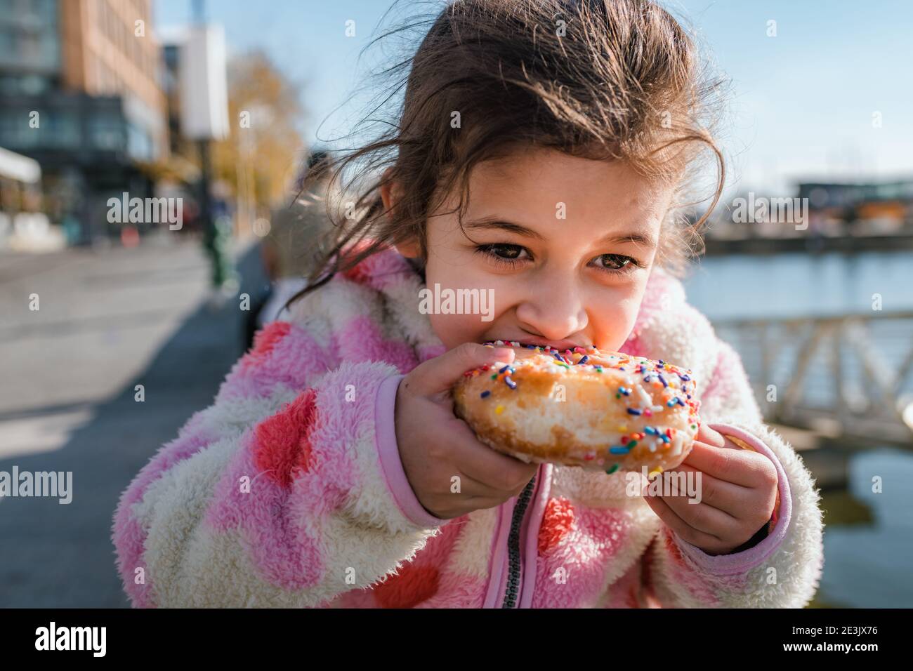 Girl eating donut hi-res stock photography and images - Alamy