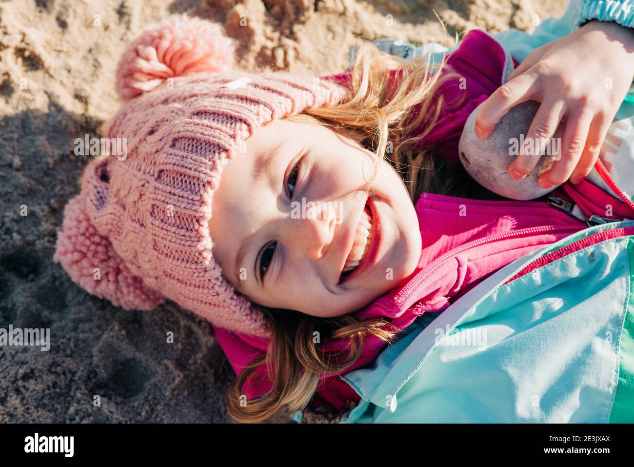 Girl laying on rocks hi-res stock photography and images - Alamy