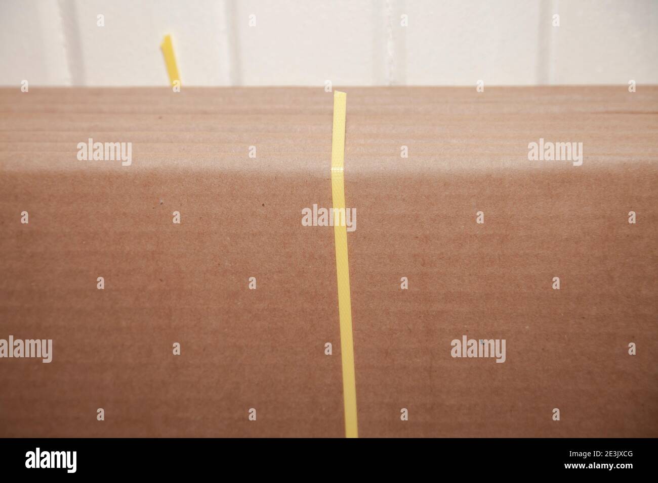 Seven unused, flattened cardboard boxes in an open package with cut ...