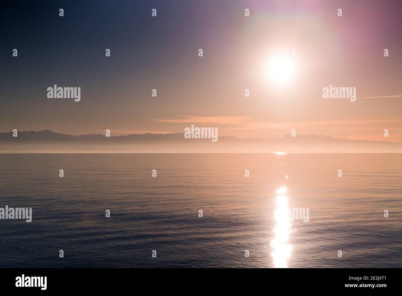 View of sunset behind island hi-res stock photography and images - Alamy