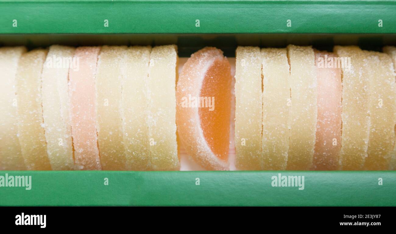 The marmalade are located in green packaging. Texture background lemon ...