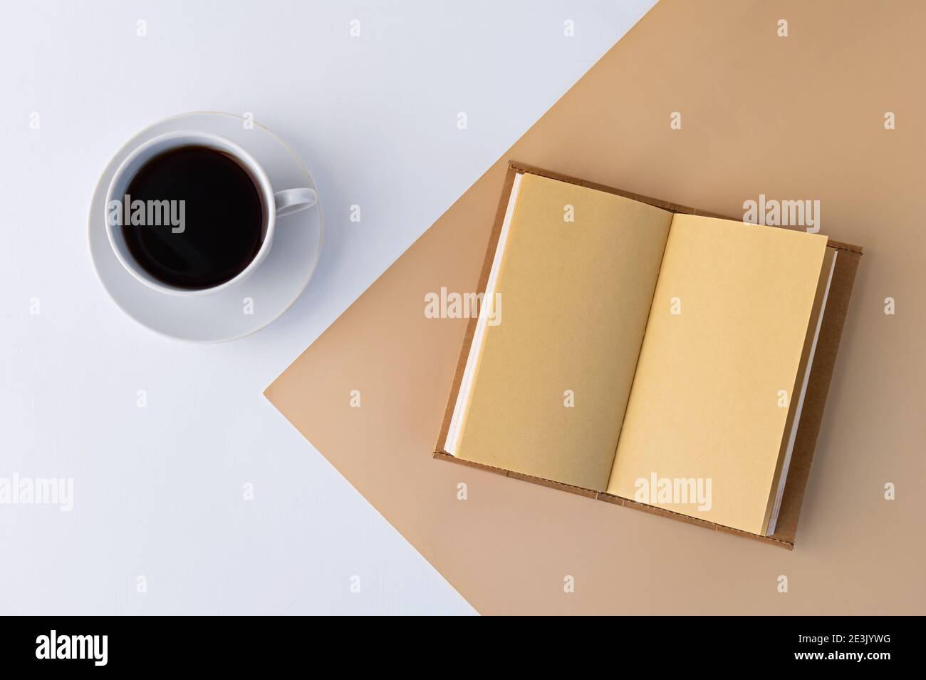 Cup of coffee and diary. Minimalism and office concept. Flat lay. Top ...
